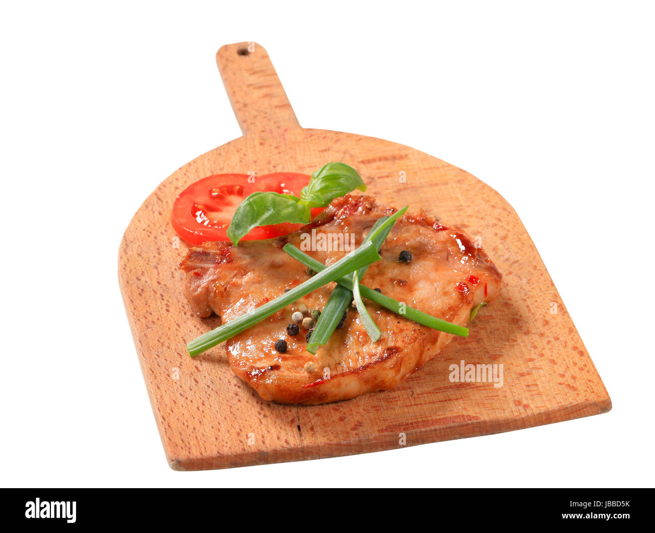 Spicy pork cutlet on cutting board Stock Photo - Alamy