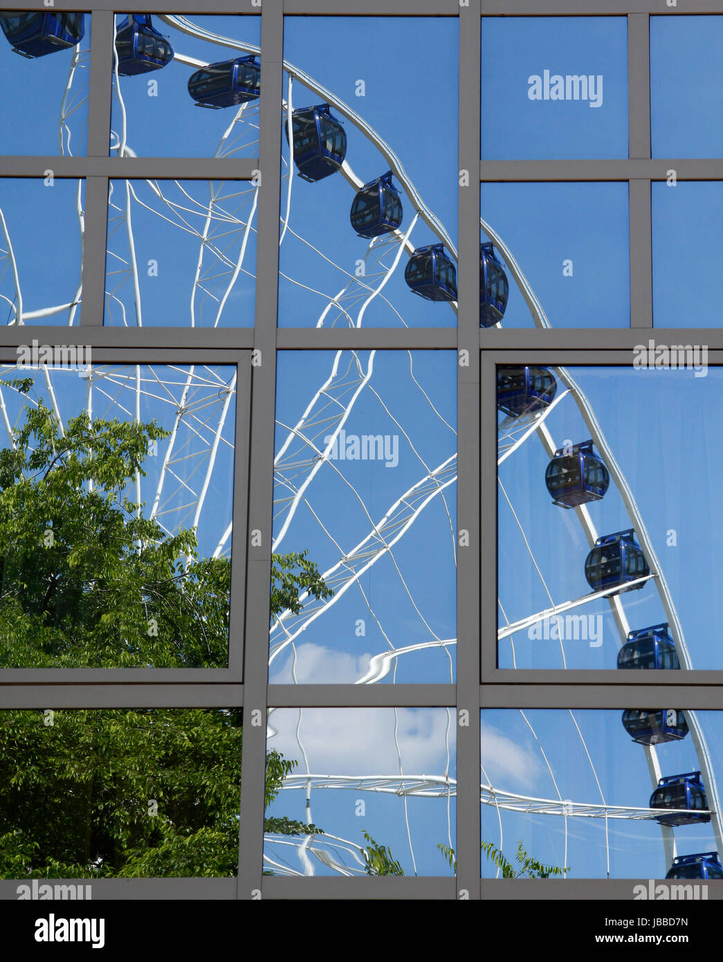 Office building reflected in the window of the big wheel Stock Photo ...