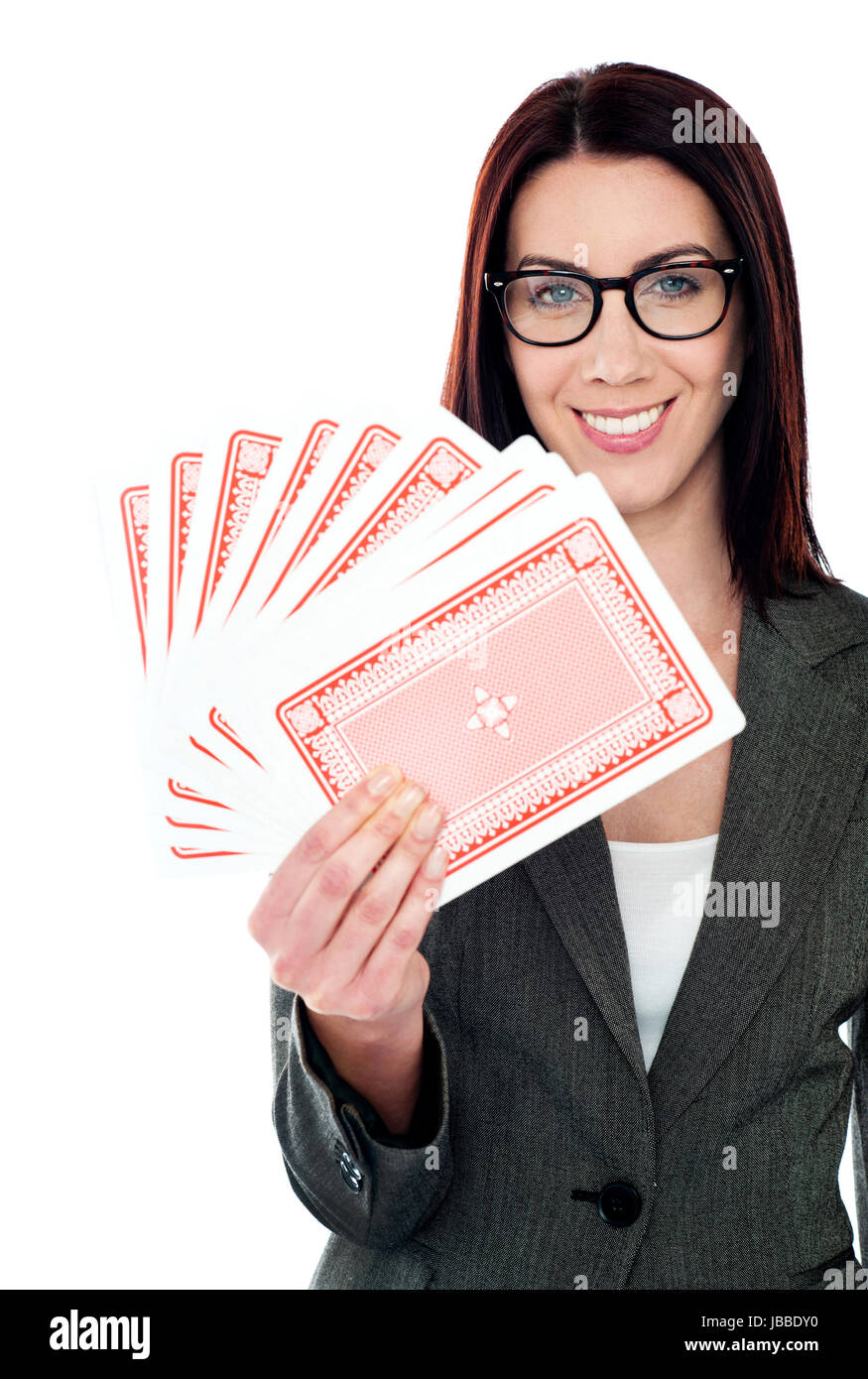 A beautiful woman holding playing cards trying her luck Stock Photo - Alamy