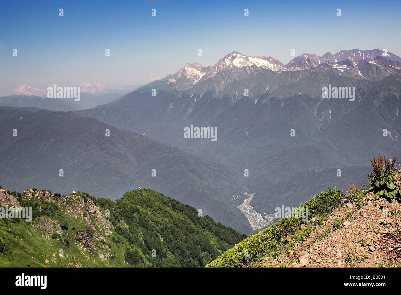 Mountain landscape: steep mountains covered with forests, form a deep ...