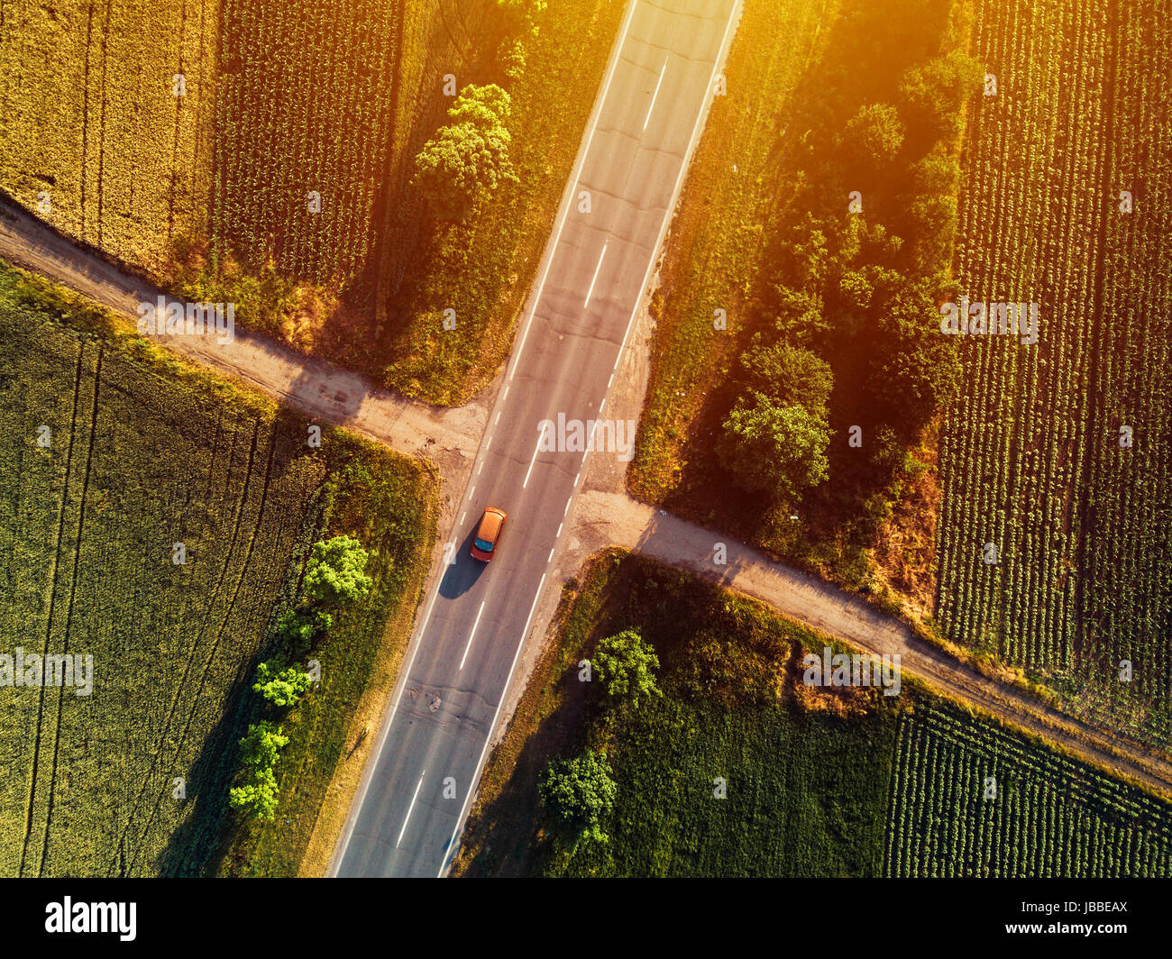 Aerial view of traffic on two lane road through countryside and ...