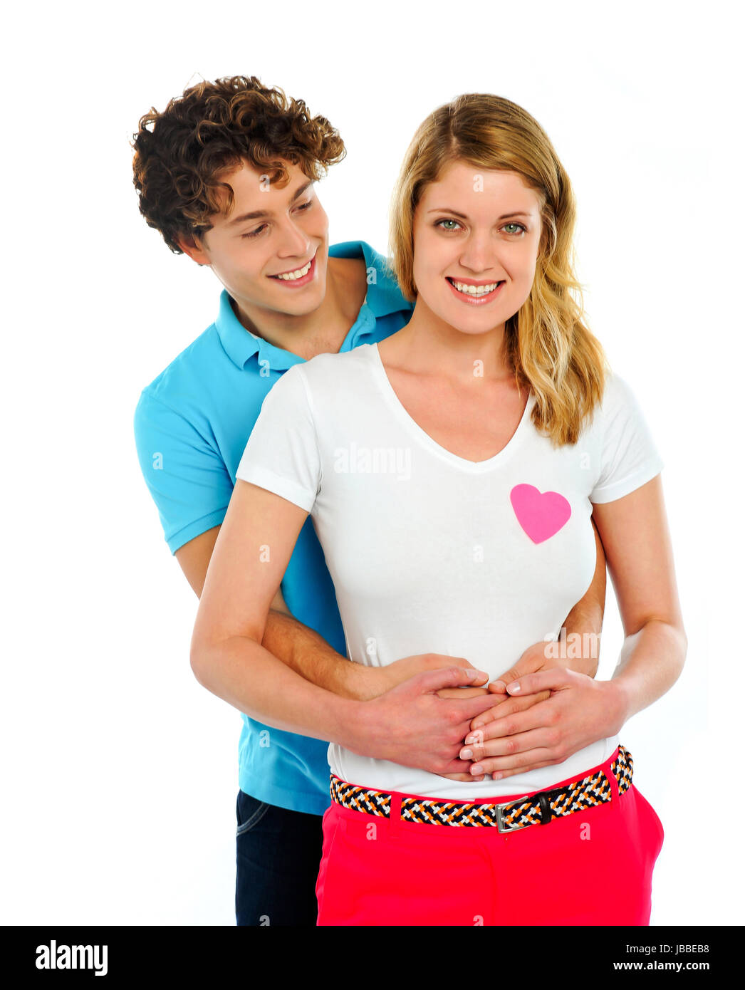 Loving couple embracing. Guy hugging his girl from behind Stock Photo ...