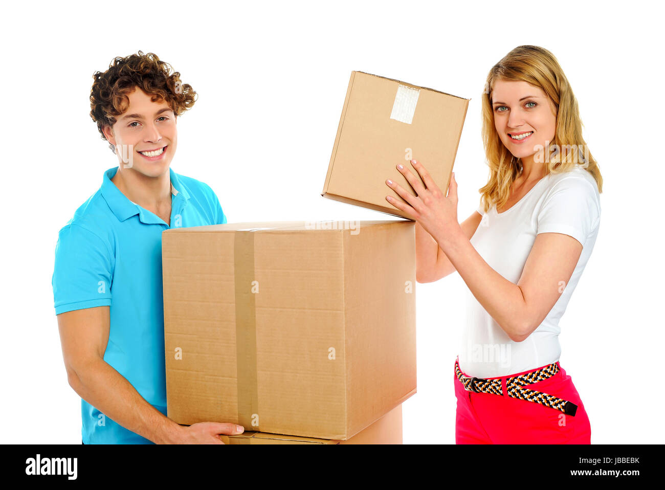 Smiling Young Couple Holding Cardboard Boxes Moving To A New Place