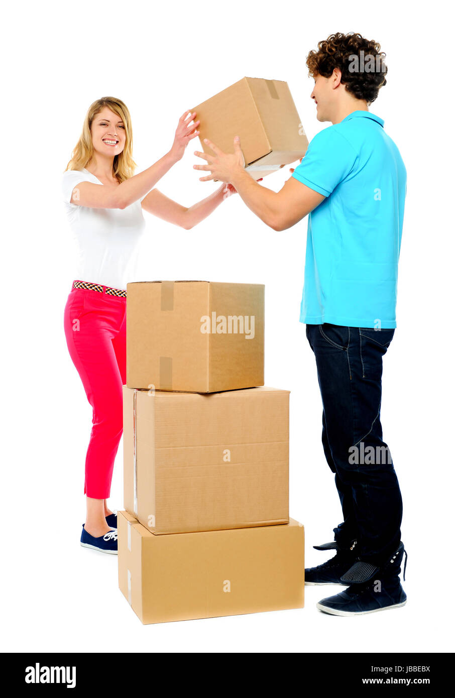 Couple carrying empty cartons isolated over white background Stock ...