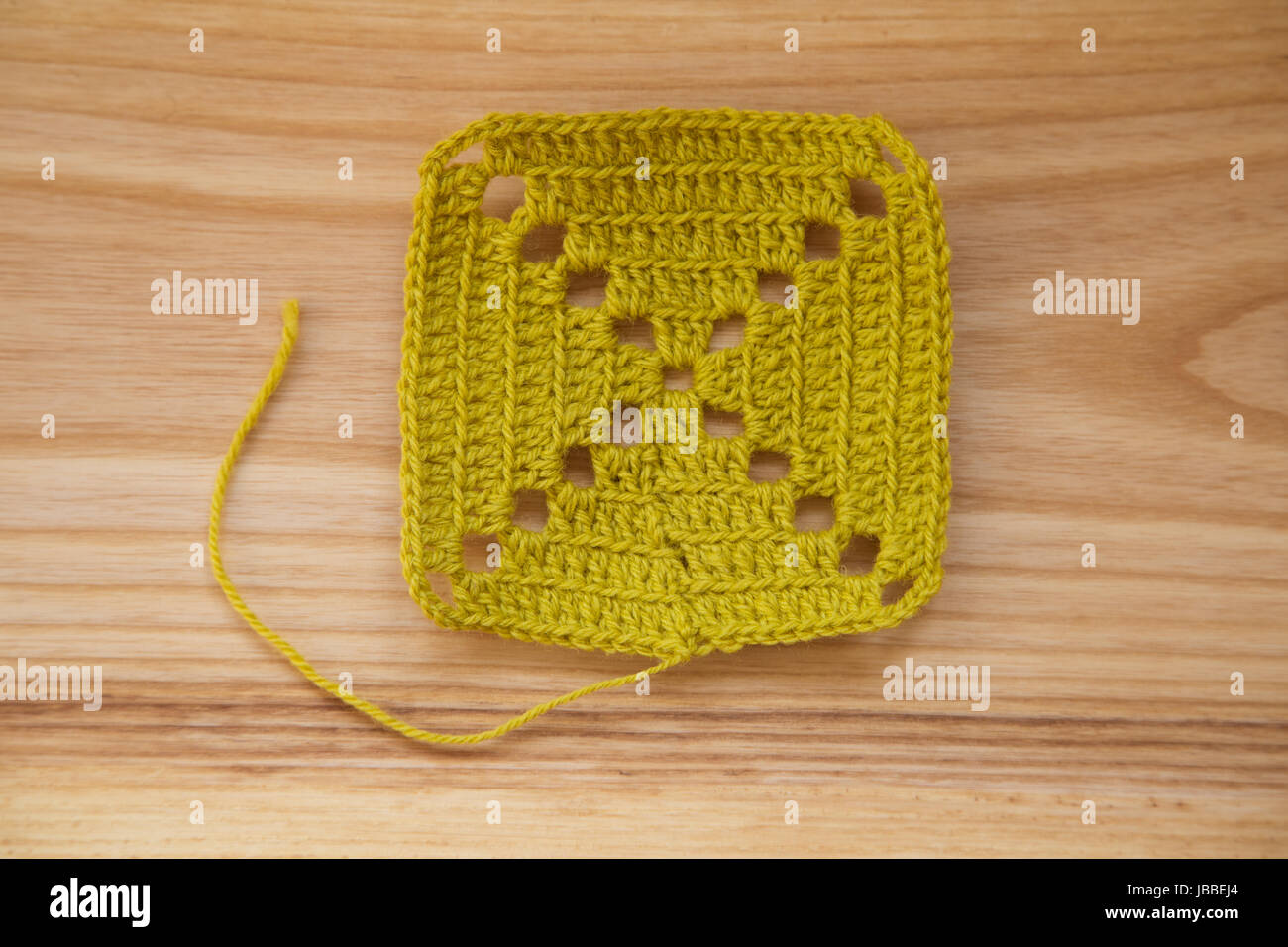 A beautiful hand crocheted pattern pieces of vibrant color gradient in ...