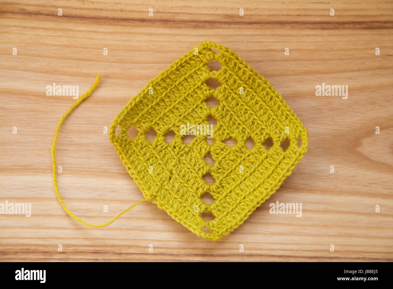 A beautiful hand crocheted pattern pieces of vibrant color gradient in ...