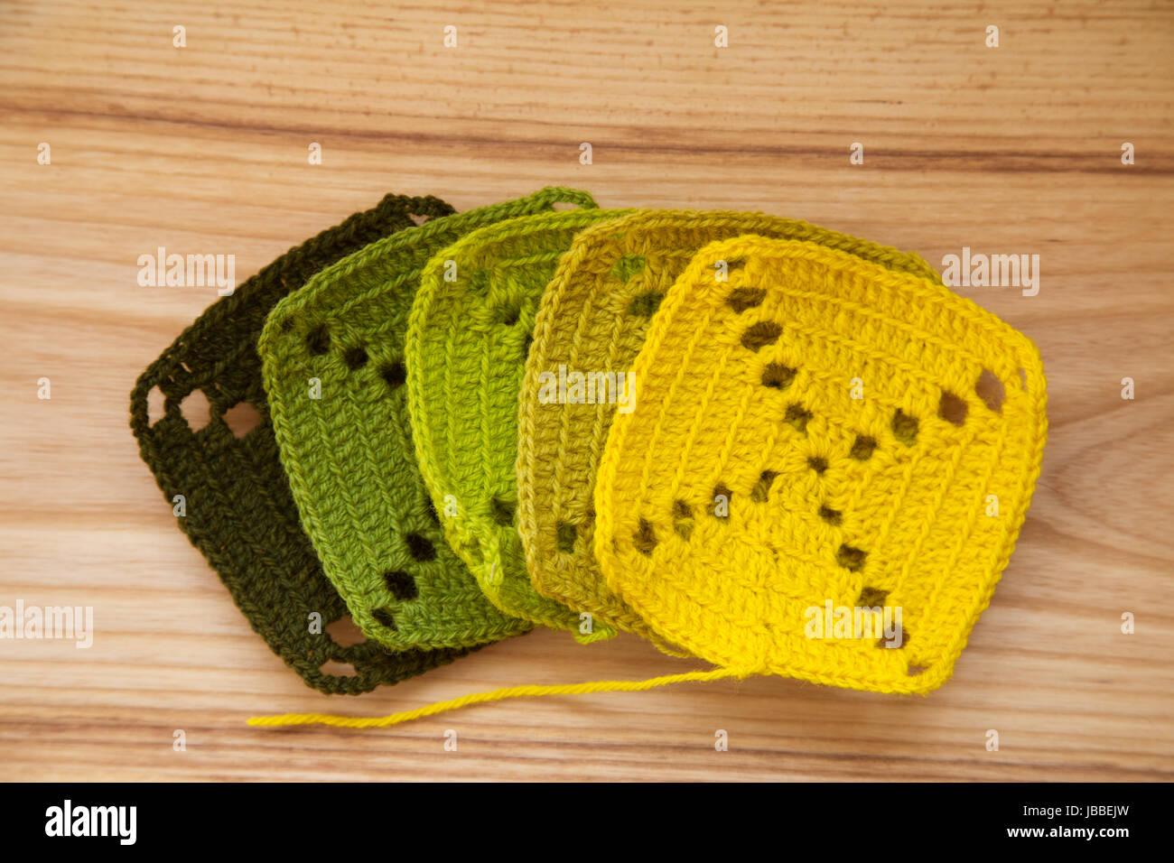 A beautiful hand crocheted pattern pieces of vibrant color gradient in ...