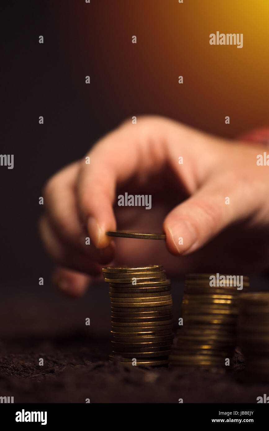 Farmer stacking coins, agricultural income and profit increase Stock ...
