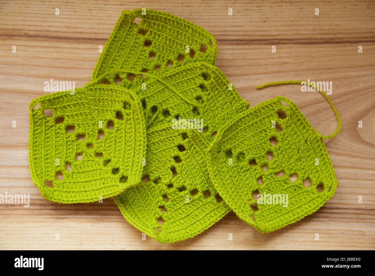 A beautiful hand crocheted pattern pieces of vibrant color gradient in ...