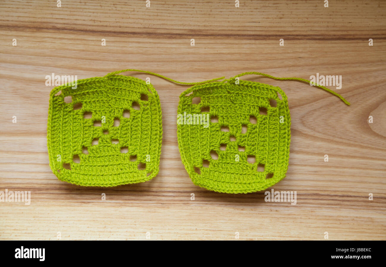 A beautiful hand crocheted pattern pieces of vibrant color gradient in ...