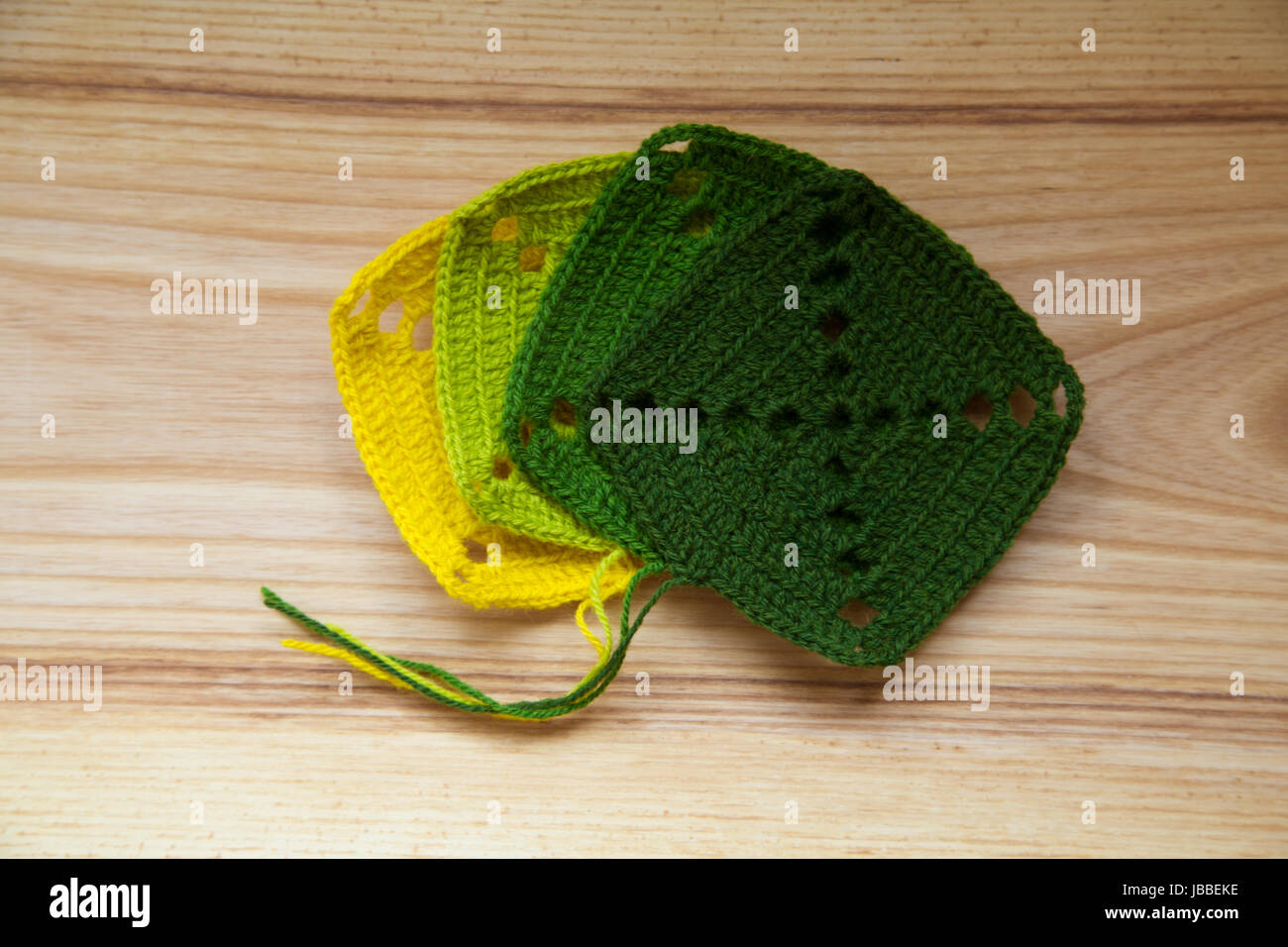 A beautiful hand crocheted pattern pieces of vibrant color gradient in ...