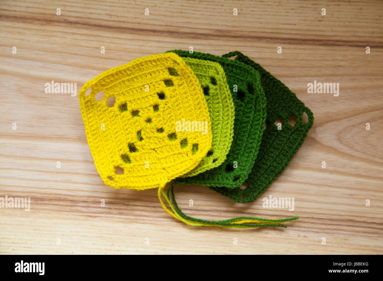 A beautiful hand crocheted pattern pieces of vibrant color gradient in ...