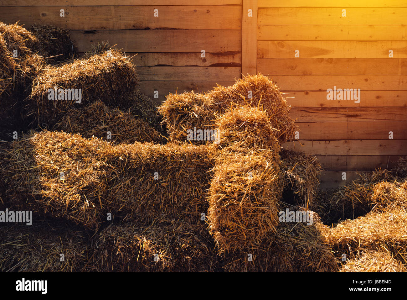 Dry baled hay stack, rural countryside background Stock Photo - Alamy