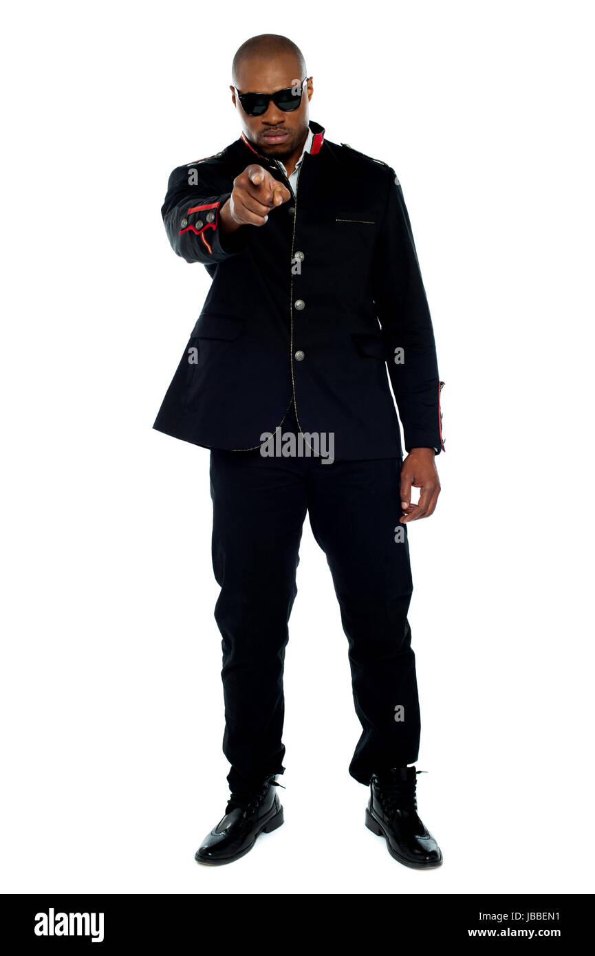 Portrait of fashion model pointing at you isolated over white ...