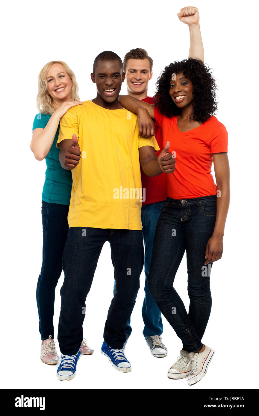 Joyful young group of friends, full length shot Stock Photo - Alamy