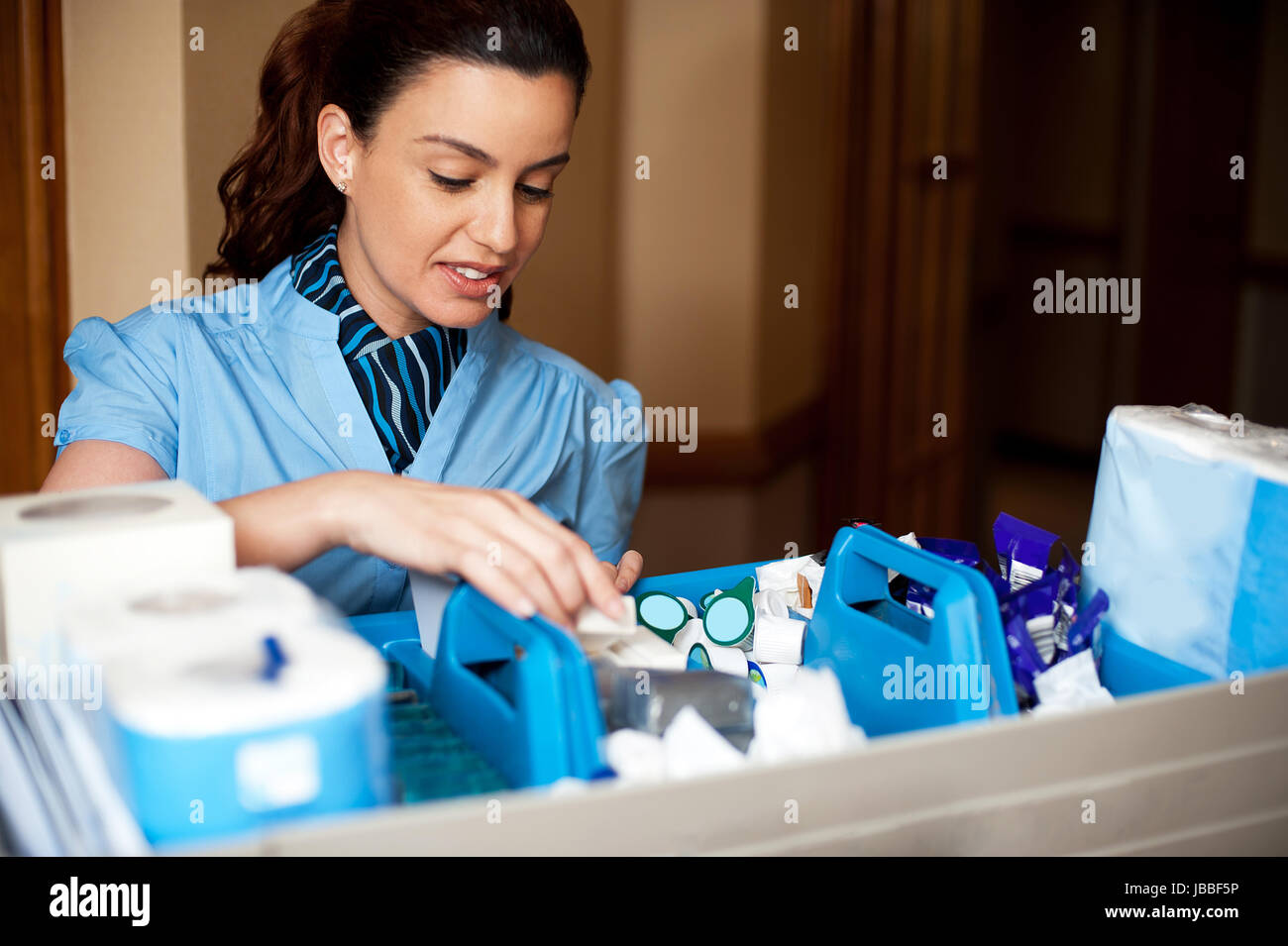Pretty female housekeeper busy working hi-res stock photography and ...