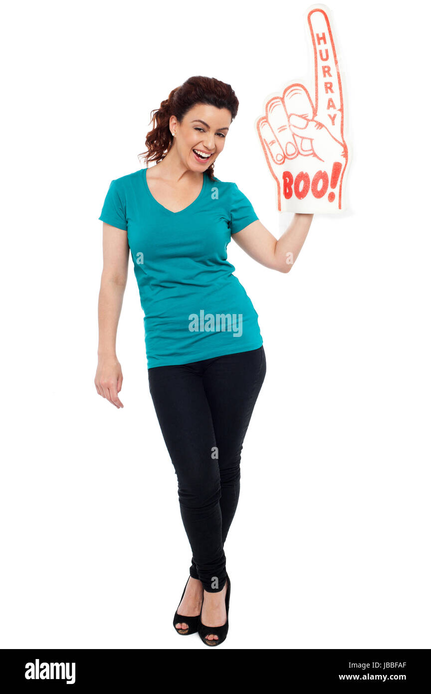 Woman cheering with large boo hurray foam hand. Full length portrait ...