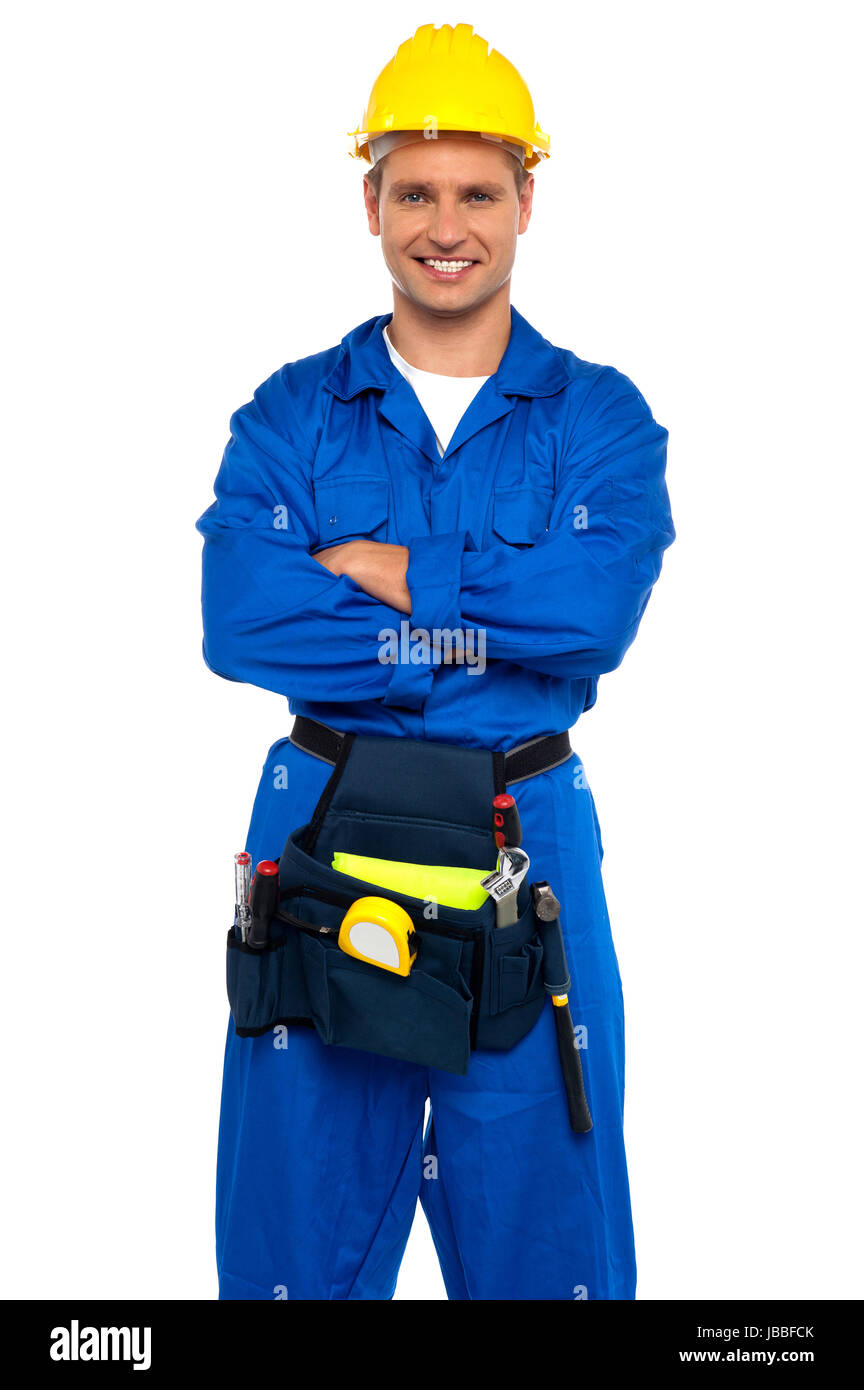 Young industrial contractor posing with crossed arms isolated over ...