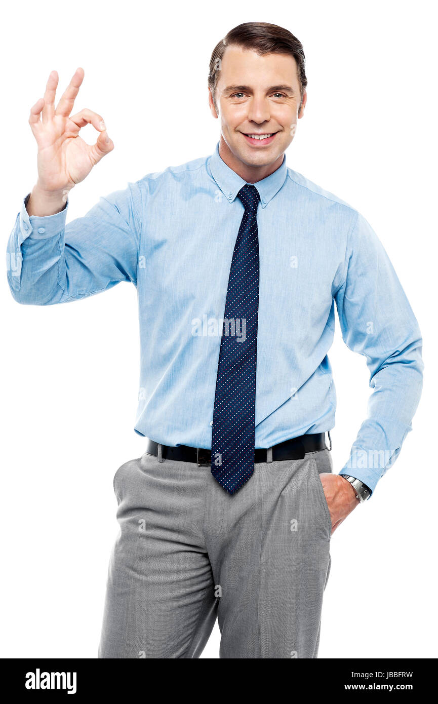 Team leader gesturing okay sign to his subordinates. All against white ...