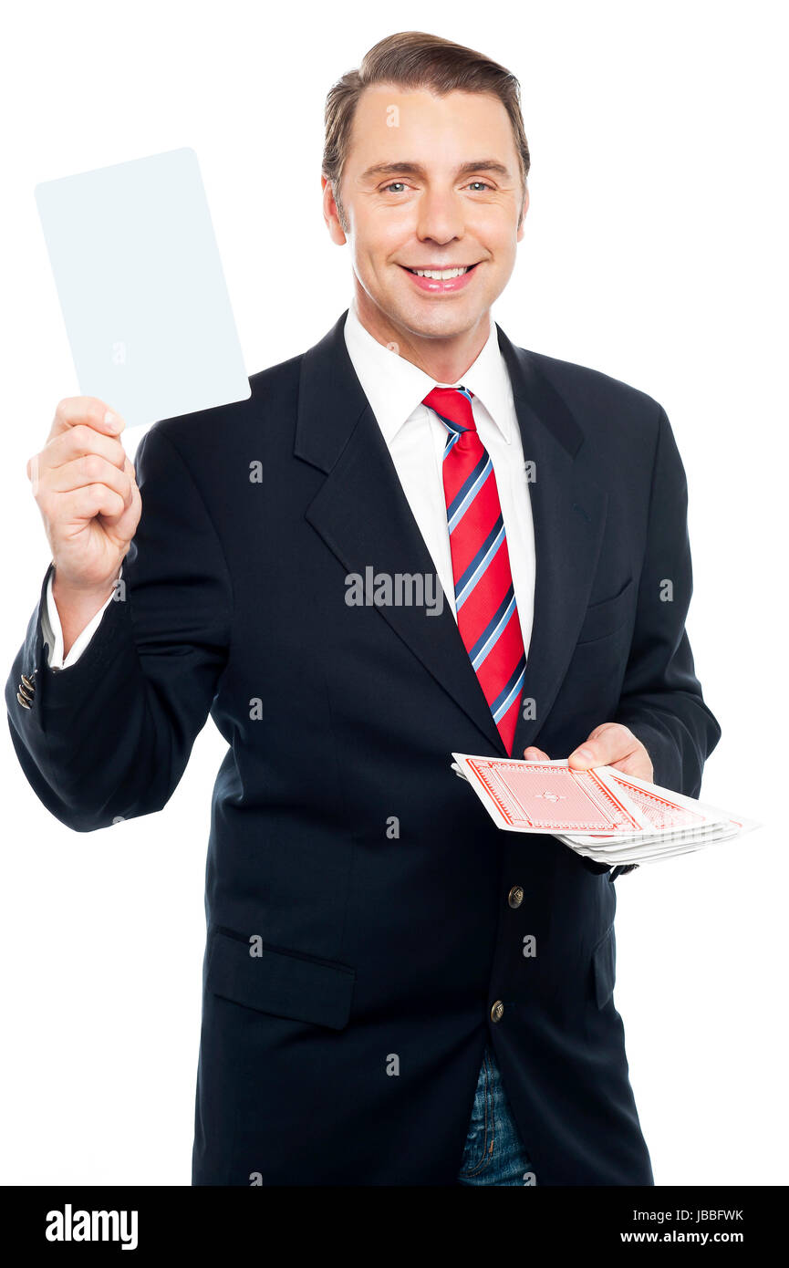 Executive showing blank playing card to camera while holding deck of ...