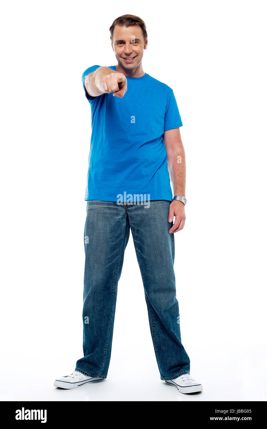 Handsome smiling man pointing straight at you Stock Photo - Alamy