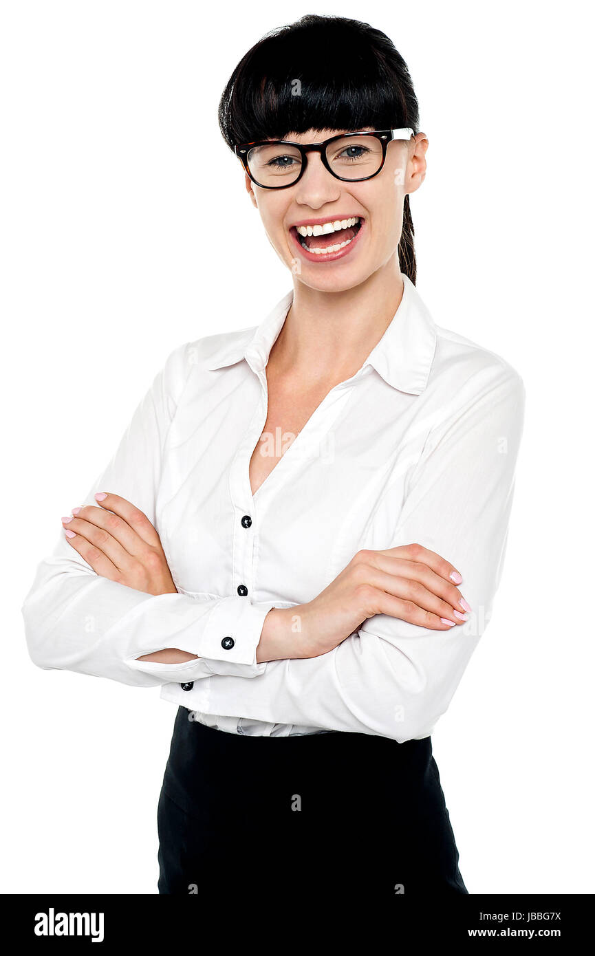 Bespectacled happy woman posing casually with arms folded Stock Photo ...