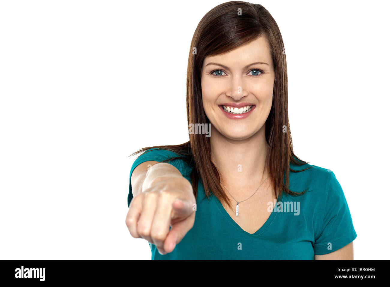 Gorgeous female pointing towards the camera and flashing a smile Stock ...