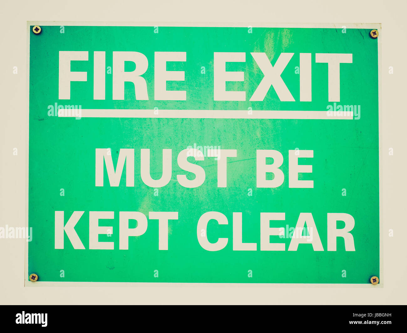 Vintage retro looking Fire exit sign with white text over green Stock ...
