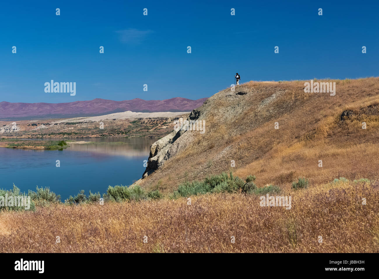 Hiker along the route to White Bluffs in Hanford Reach National ...