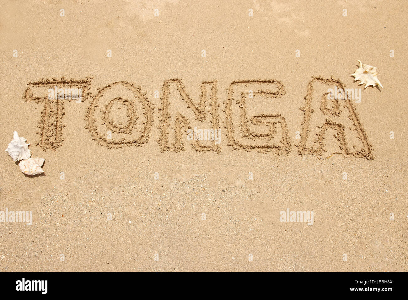 Word "Tonga" written in a sand - travel concept Stock Photo - Alamy