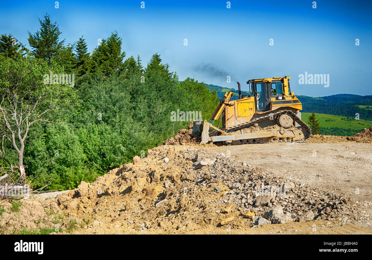 bulldozer a moving land shovel Stock Photo - Alamy