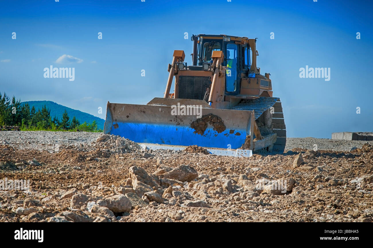 bulldozer a moving land shovel Stock Photo - Alamy