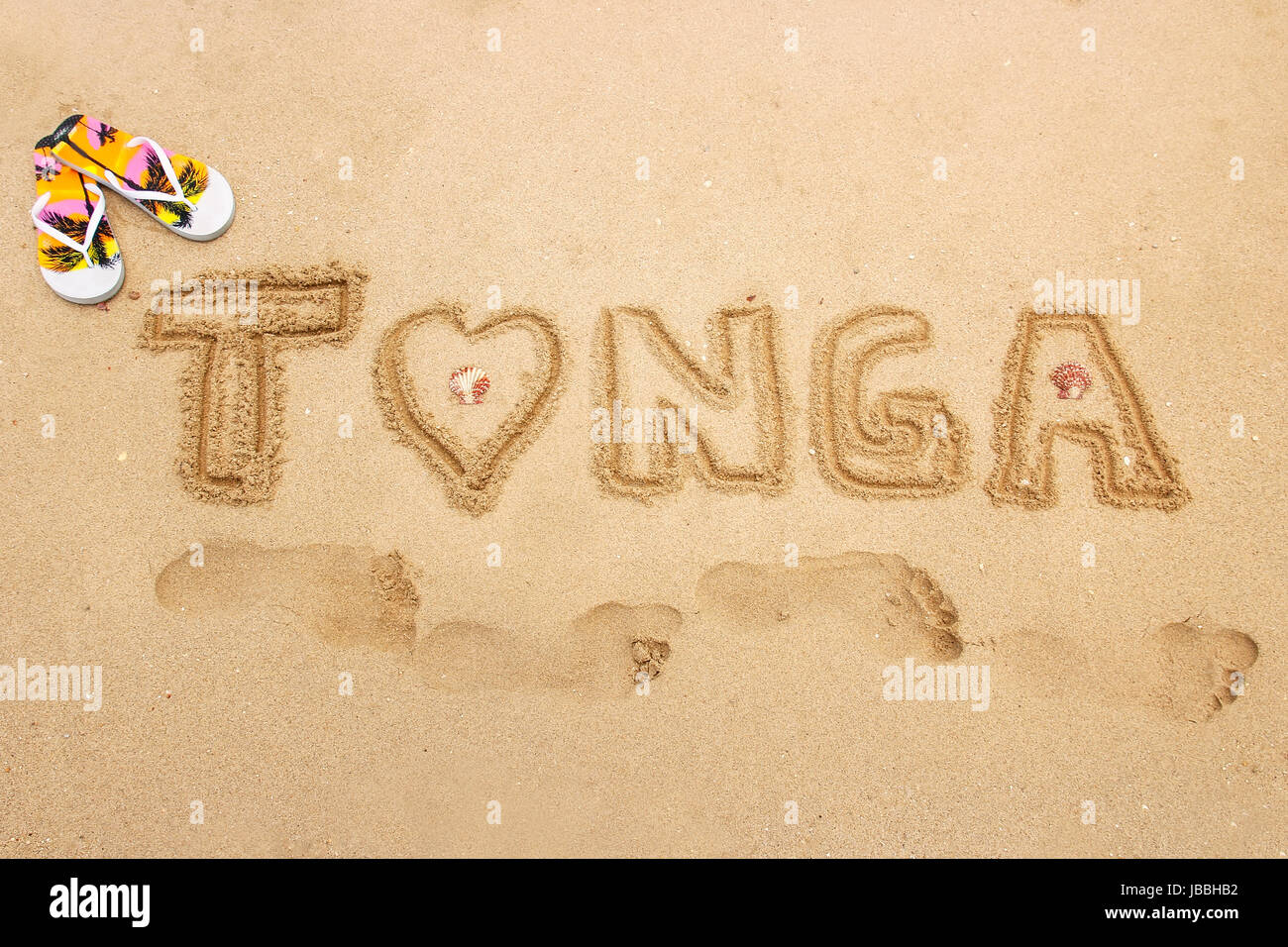 Word "Tonga" written in a sand - travel concept Stock Photo - Alamy