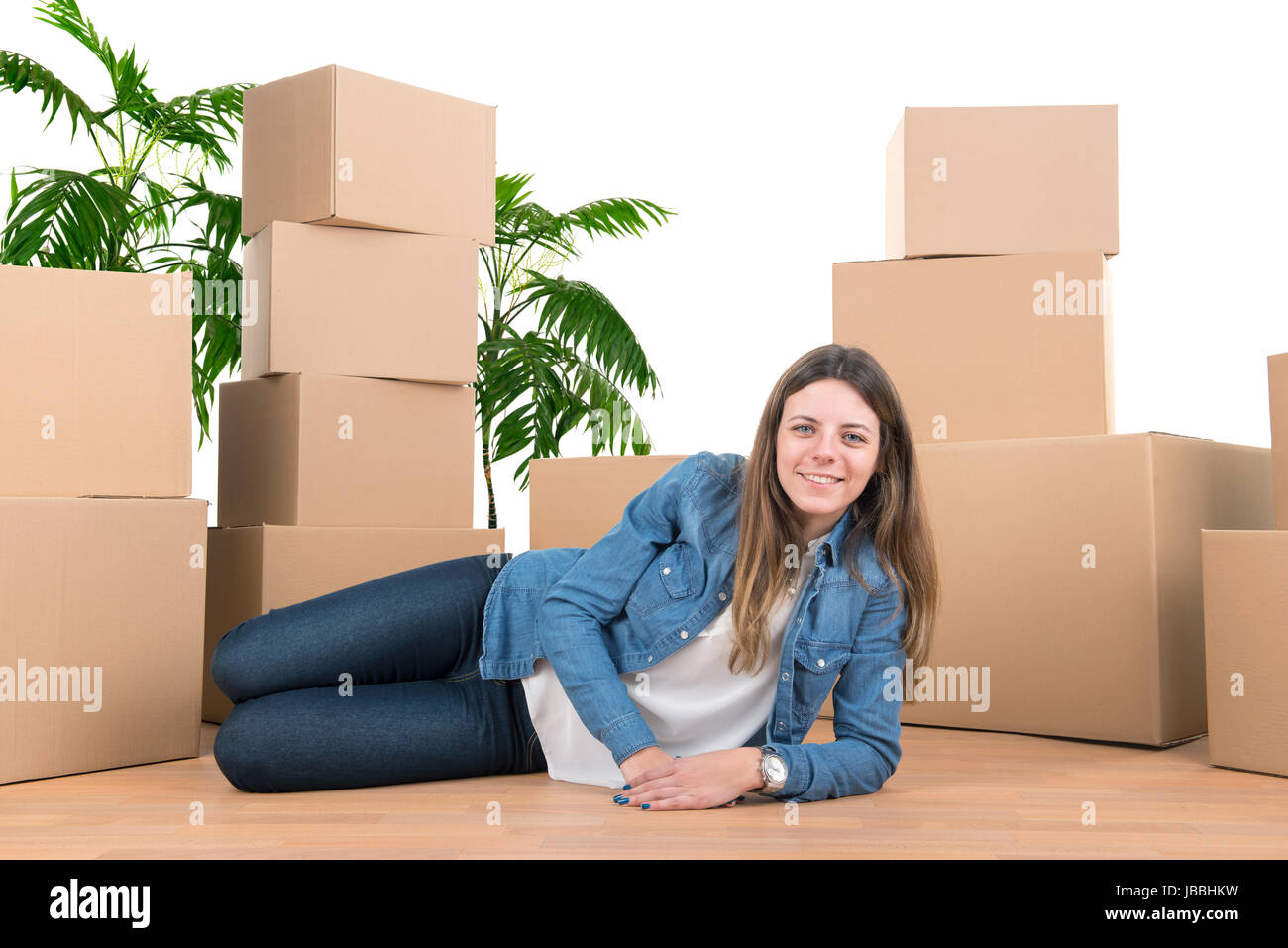 Beautiful girl with cardboard boxes unpacking in new home Stock Photo ...