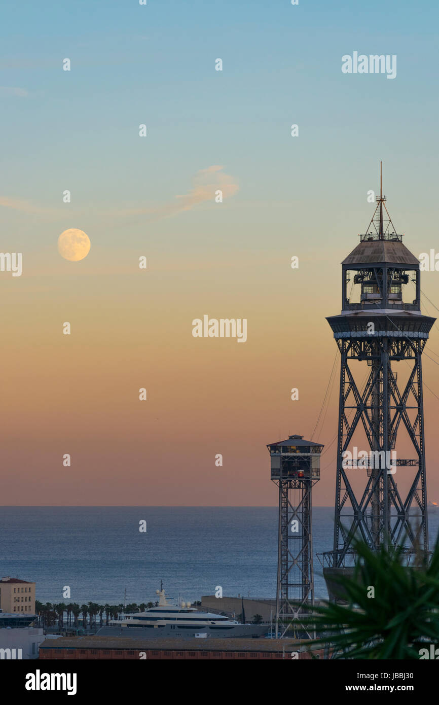 Barcelona sunset bay view with lighthouse and moon Stock Photo - Alamy