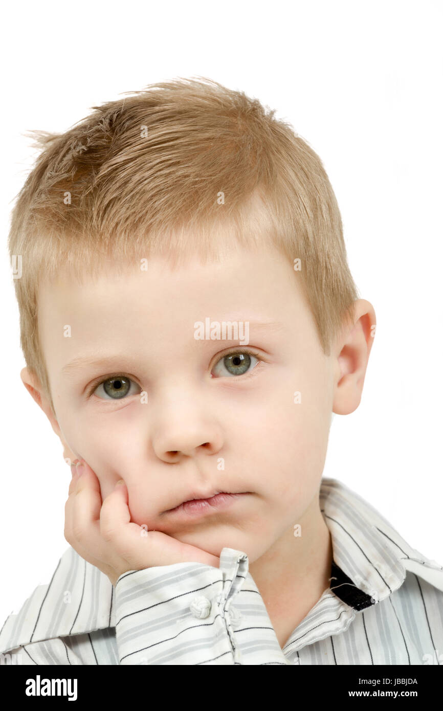 Studio portrait of young pensive beautiful boy on white background ...