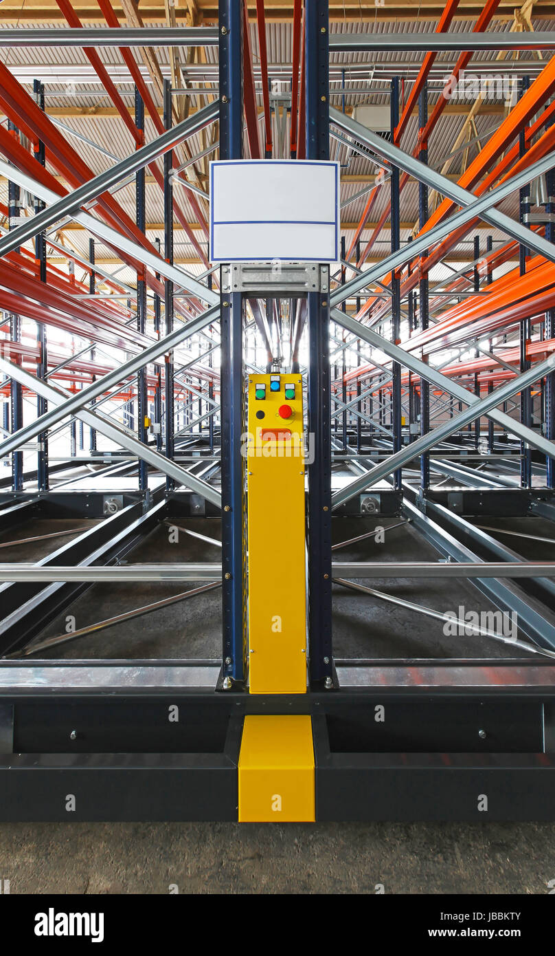 Power control of mobile shelving system in warehouse Stock Photo - Alamy
