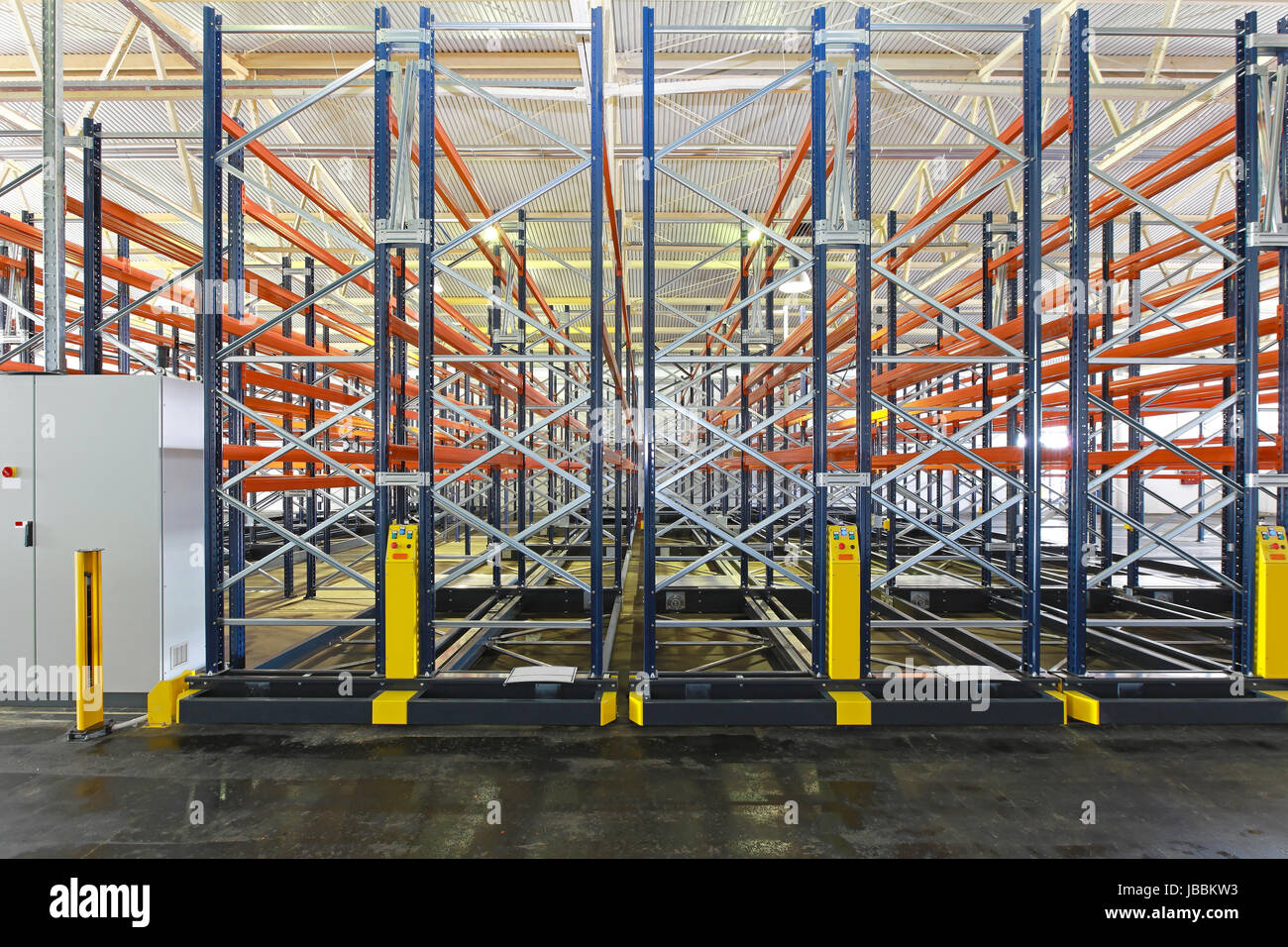 Mobile aisle roller racking system in warehouse Stock Photo - Alamy