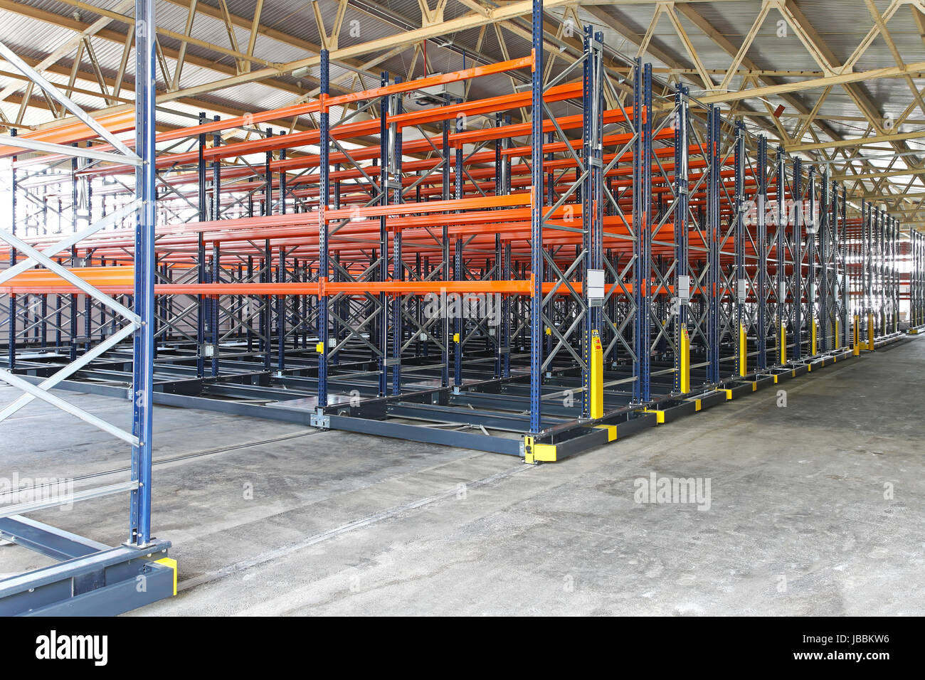 Mobile shelving roller system in distribution warehouse Stock Photo - Alamy