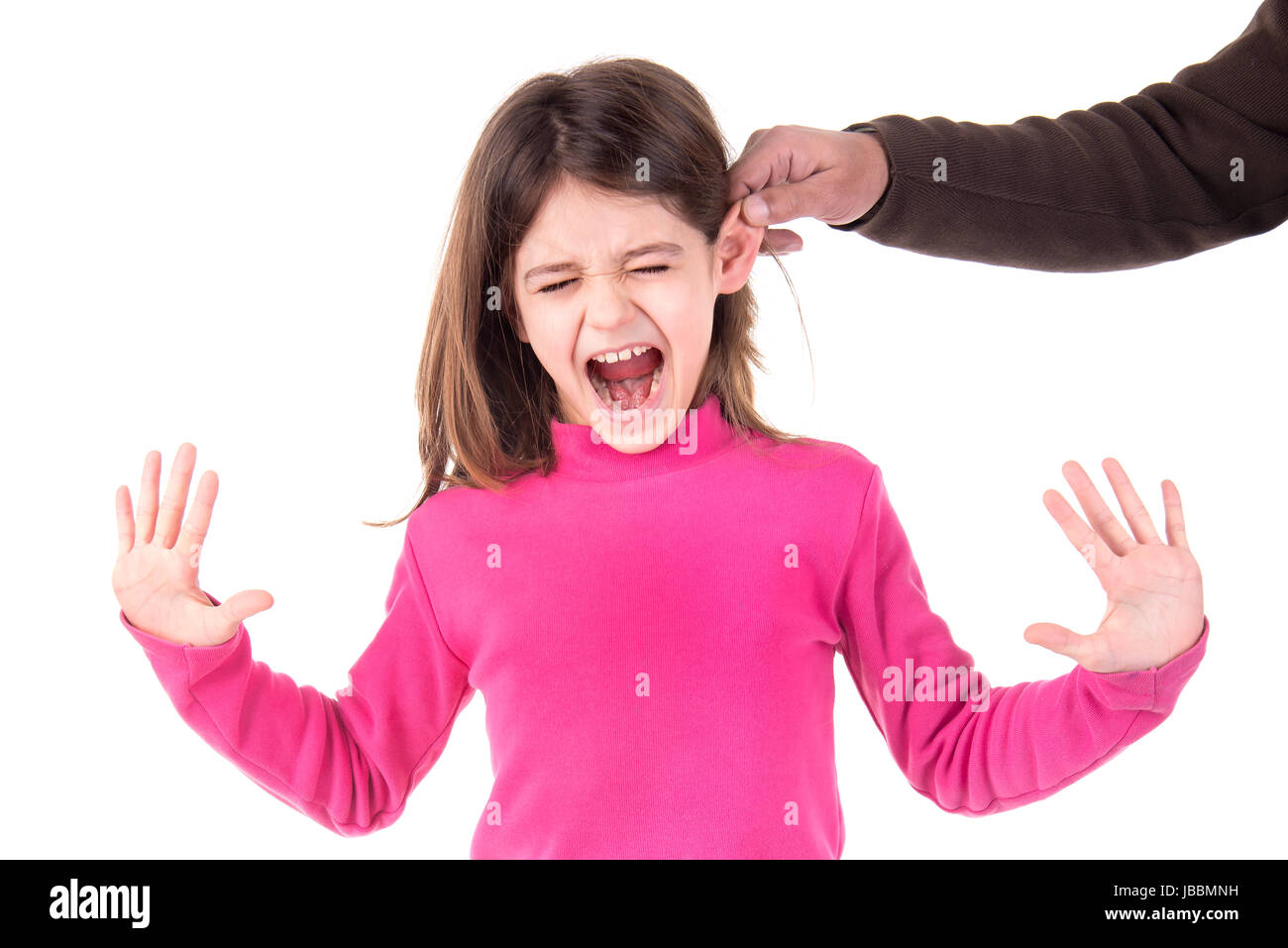 Young girl being punished with ear pulling Stock Photo - Alamy
