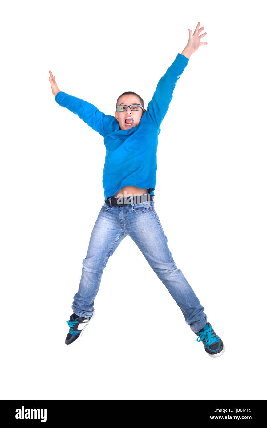 Young boy jumping isolated in white Stock Photo - Alamy