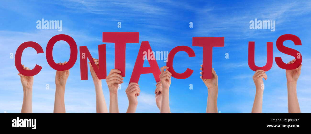 Hands Holding Contact Us in Front of the Sky Stock Photo - Alamy
