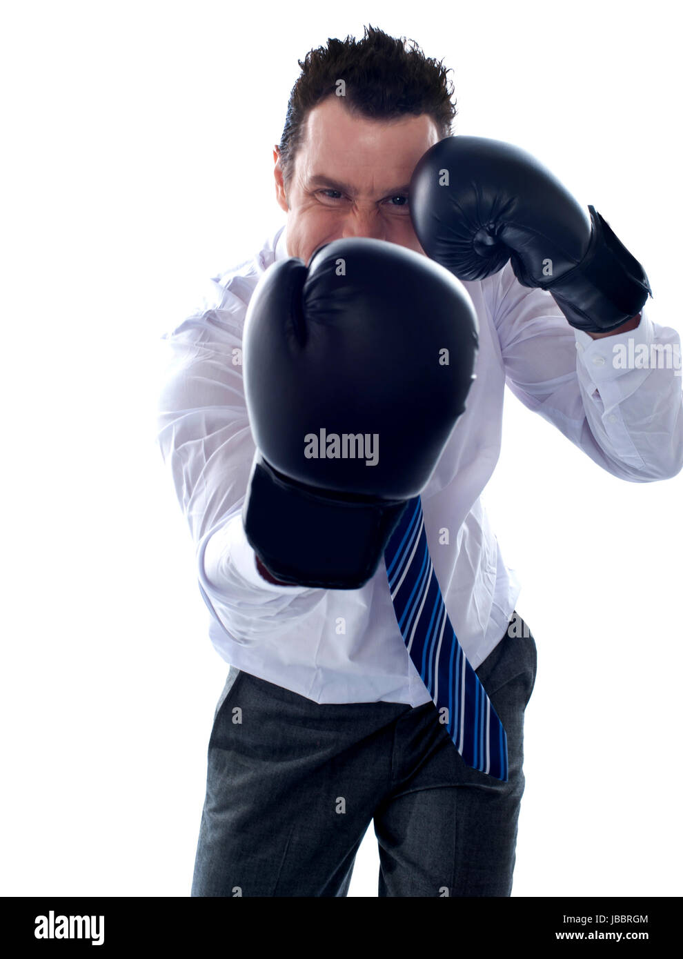 Corporate man posing boxing punch isolated against white background ...