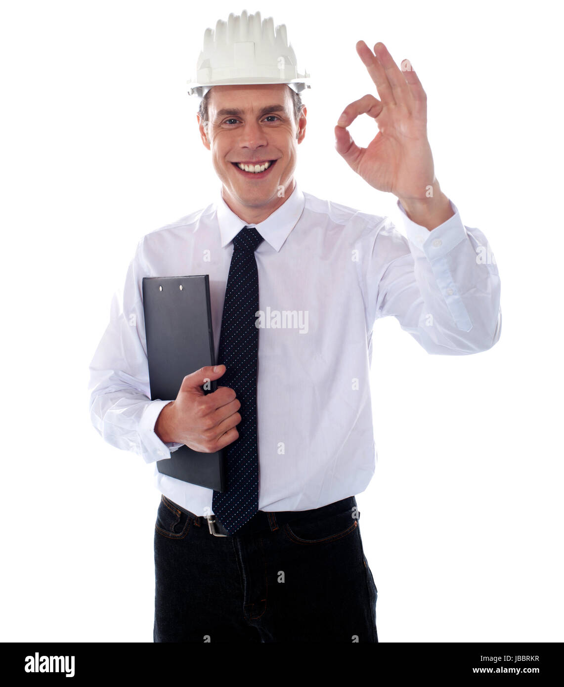 Handsome engineer showing okay gesture wearing safety helmet and ...