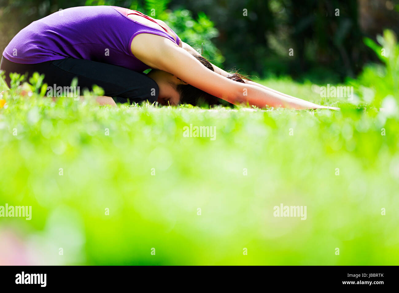 1 Teenager Girl Yoga Stretching Shashankasana Exercise In Park Stock ...