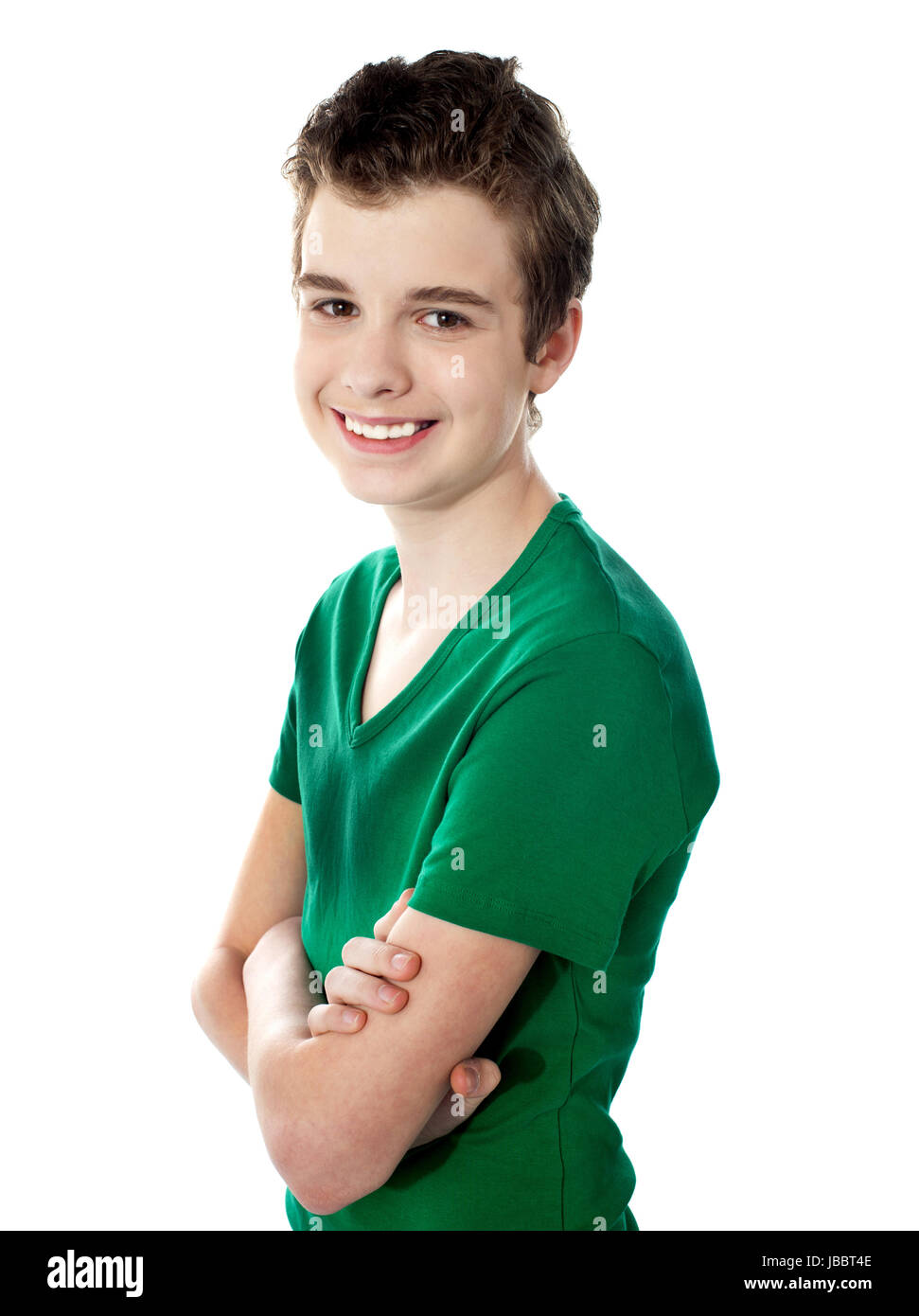 Young boy posing with folded arms isolated against white background ...
