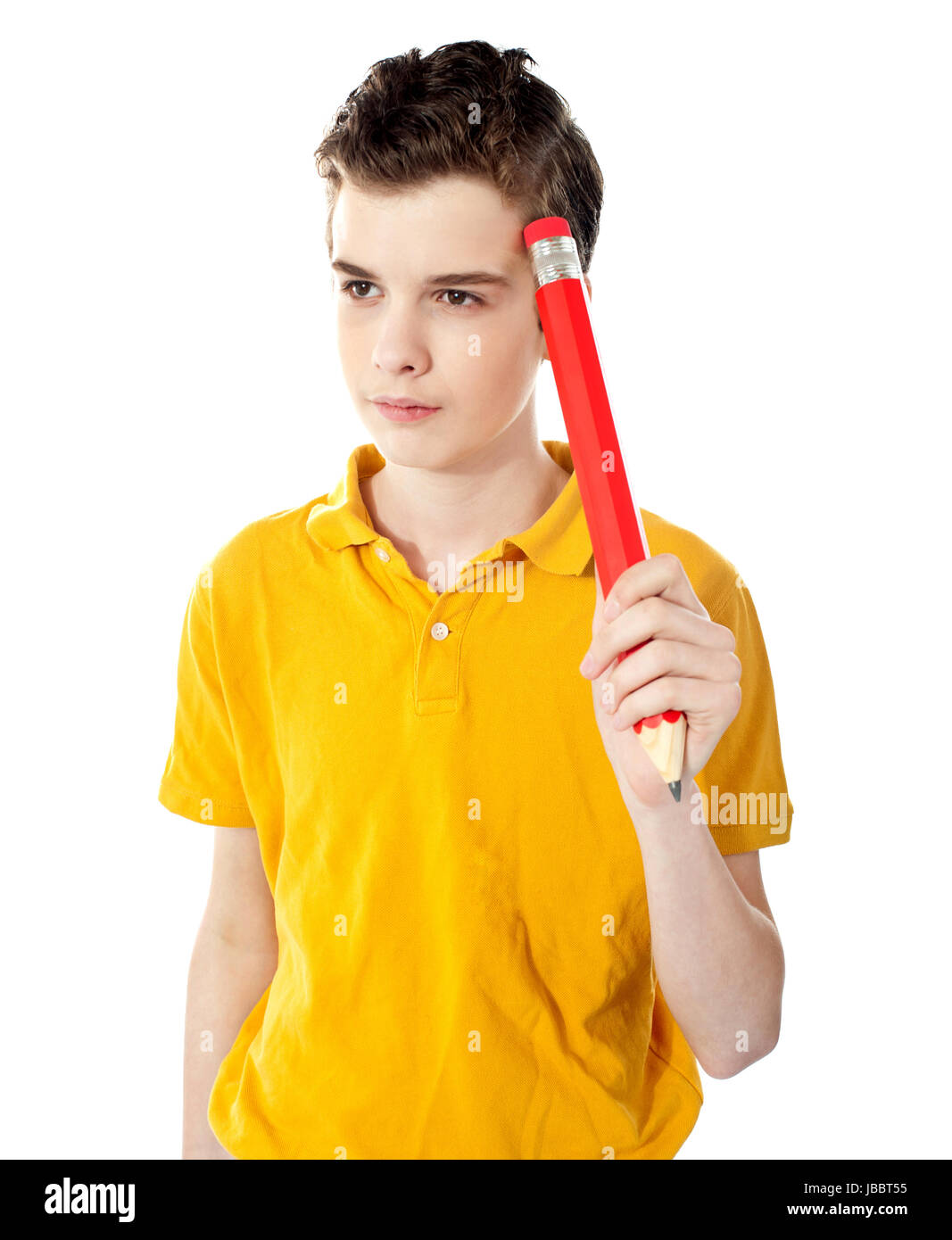Thoughtful boy holding a pencil isolated on a white background Stock ...