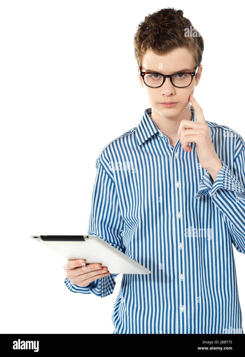Trendy techy boy thinking something while holding wireless device Stock ...