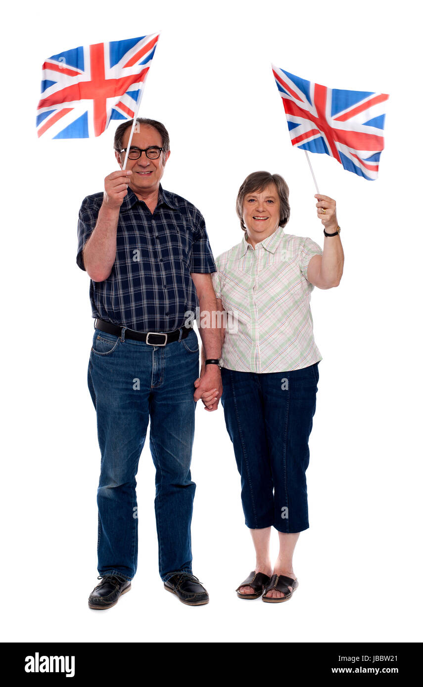 Senior citizens supporting their nation by holding flags Stock Photo ...