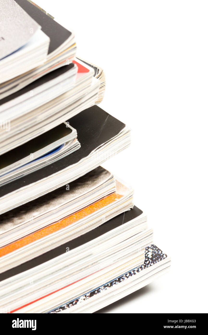 Stack of color magazines on white background Stock Photo - Alamy